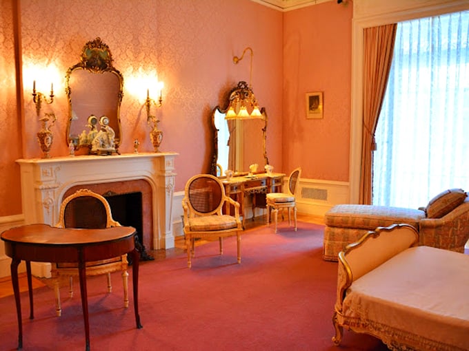 Pretty in pink with a fireplace fit for royalty. It's like Barbie's dream house got a historical makeover.