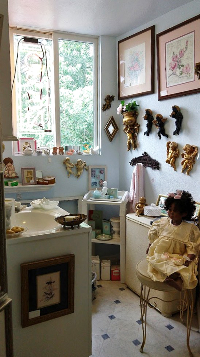 Dollhouse dreams come true! This cozy corner is a miniature wonderland, where cherubic figurines and delicate decor create a world of whimsy.