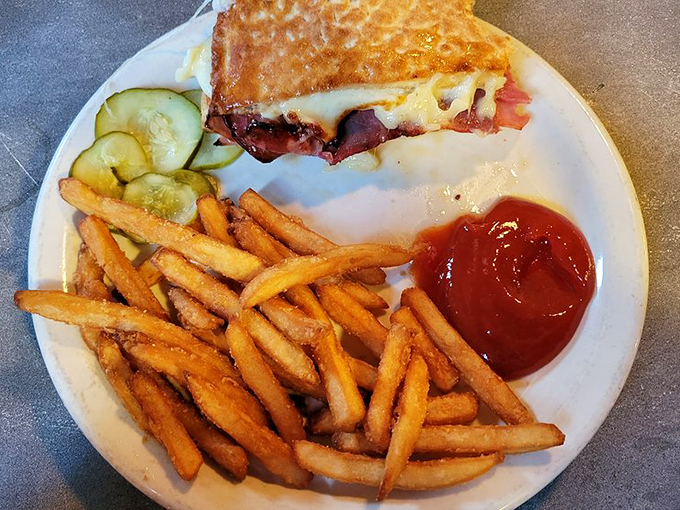 A sandwich that's more stacked than a firehouse crew. Those crispy fries are the perfect sidekick to this hearty hero.