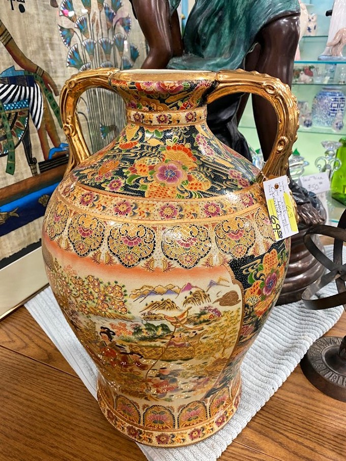 This vase is giving me serious "I Dream of Jeannie" vibes. It's so ornate, I half expect a genie to pop out and grant me three antique-hunting wishes!