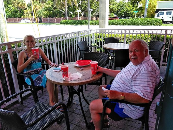 Al fresco feasting at its finest! Nothing says "Florida living" quite like donuts and palm trees. It's a tough job, but someone's gotta do it.
