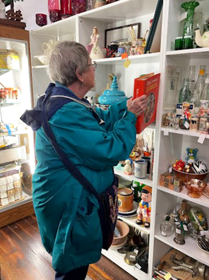 Treasure hunter at work: Watch as this patron uncovers hidden gems, proving one person's junk is another's joy.