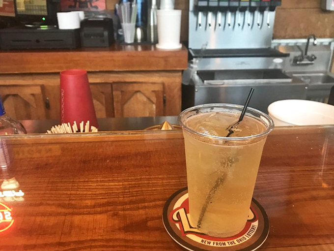 Liquid courage! This refreshing beverage is like a crisp high-five for your taste buds, perfect for washing down Woody's delectable dishes.