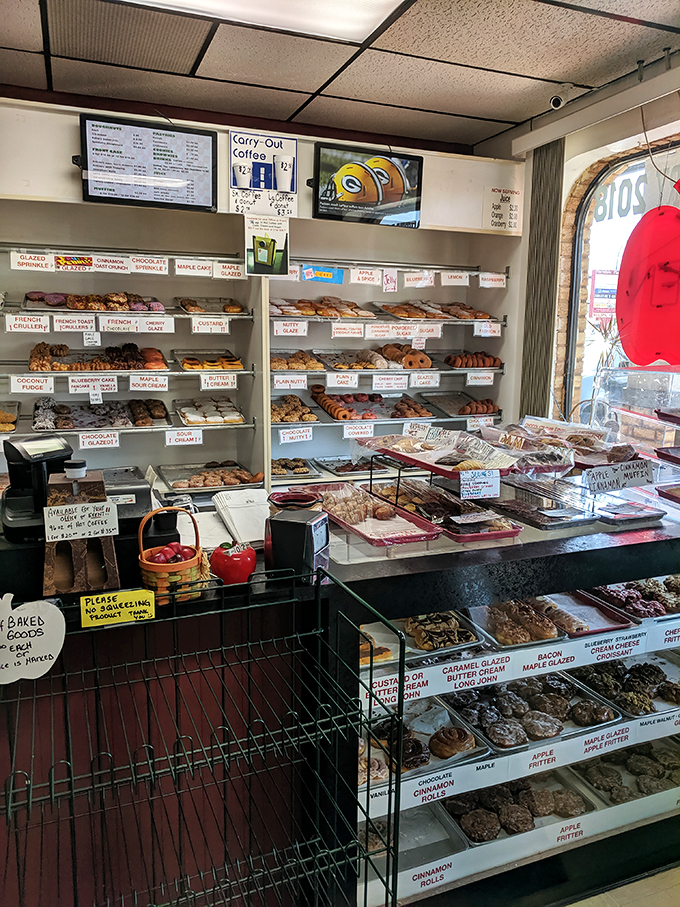 Donut nirvana awaits! This counter display is a rainbow of glazed, sprinkled, and cream-filled temptations that would make Homer Simpson weep with joy.