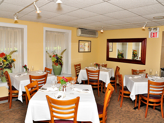 Sunshine and chandeliers create a warm glow that rivals the one in your belly after a satisfying meal. It's like dining in a cozy French farmhouse.