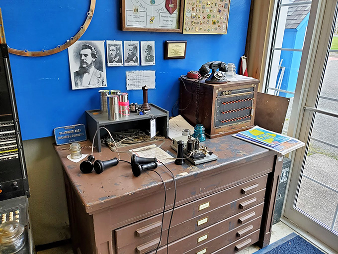 Behind the glass, these vintage phones rest like precious artifacts, each with its own story of 