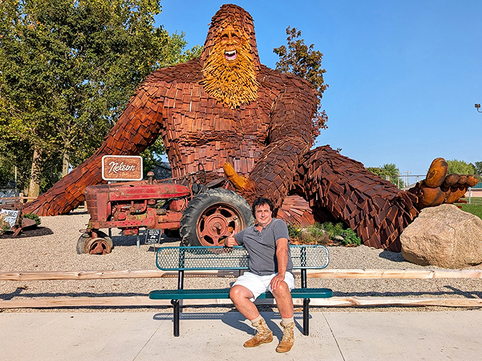 "Man meets myth! This snapshot puts Nelson's colossal size into perspective. He's not just big, he's HUGE!"