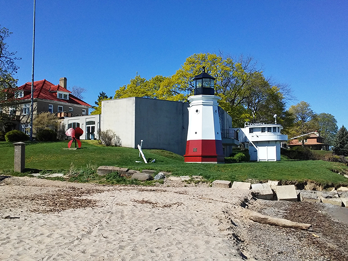 "Who says lighthouses can't have friends? This one's hanging out with some architectural pals, creating a lakeside neighborhood watch."
