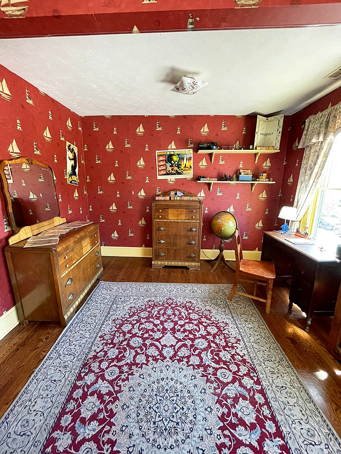 Ahoy, matey! Ralphie's room is a treasure trove of boyhood dreams, complete with sailboat wallpaper and adventure posters.