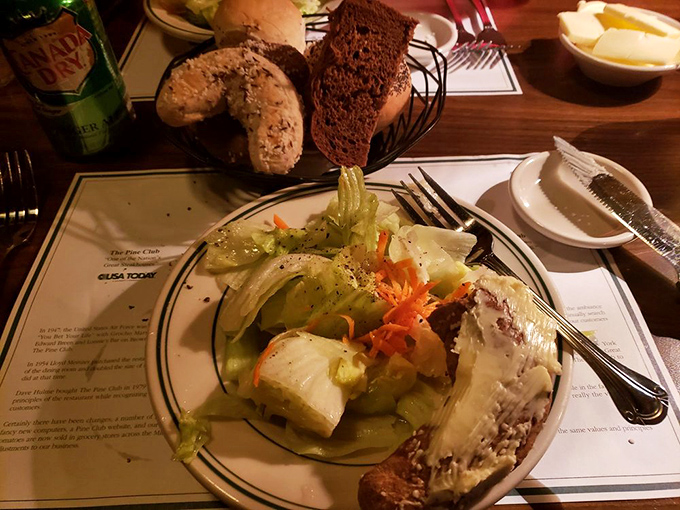 Not just rabbit food! The Pine Club's salad game is strong, with crisp greens and house-made dressings. And that bread basket? Carb heaven, my friends.