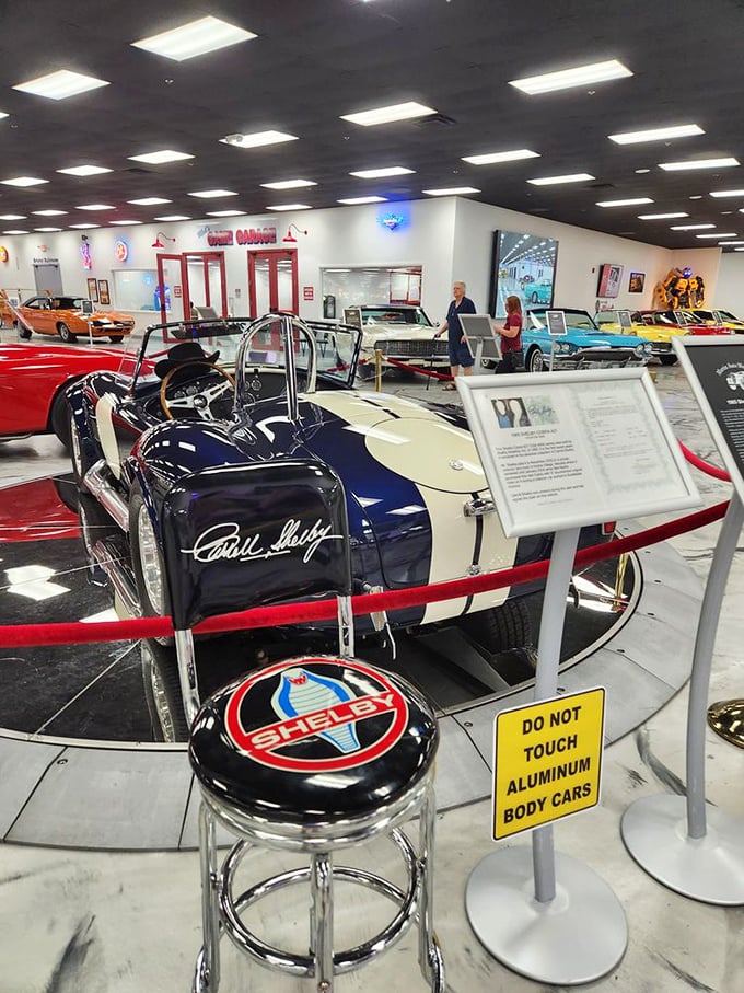 Cobra's den of automotive legends: Carroll Shelby's legacy lives on in this sleek beauty, a reminder that sometimes, legends do have four wheels.