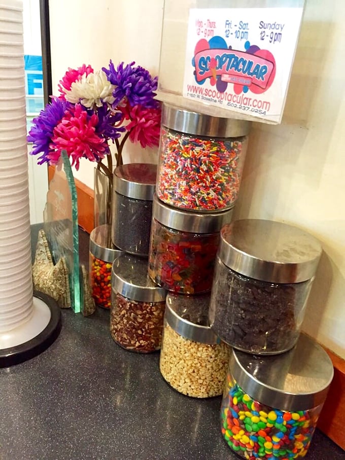 Sprinkle central! This topping station is like Willy Wonka's workshop for ice cream enthusiasts.