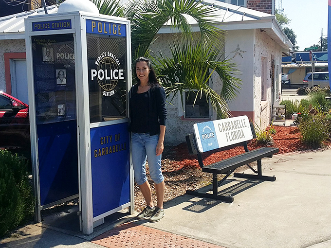 "Officer, I'd like to report a case of adorable overload." Visitors can't resist posing with Carrabelle's compact copshop.