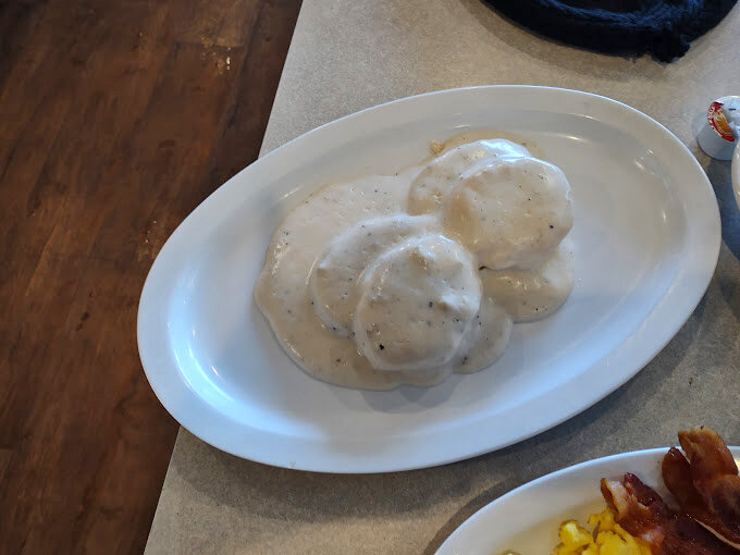 Biscuits and gravy: the unsung heroes of breakfast. These pillowy delights are swimming in gravy goodness!