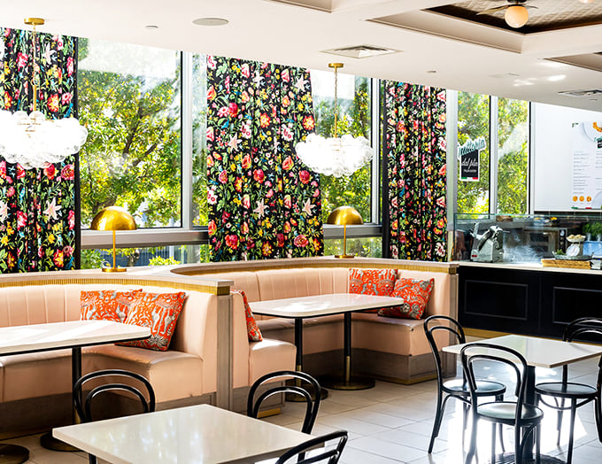 A dining room that's part tropical oasis, part Instagram dream. Those floral curtains are giving me serious vacation vibes &ndash; pass the pi&ntilde;a colada!