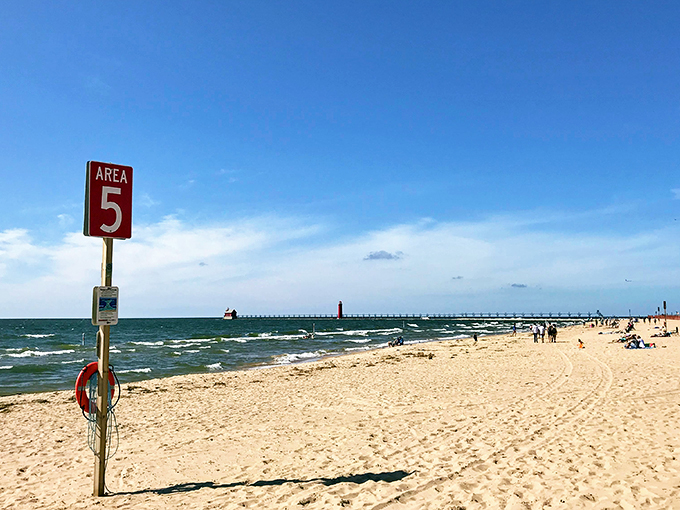 Bustling boardwalk meets serene shoreline. Grand Haven: where beach town charm goes to show off.