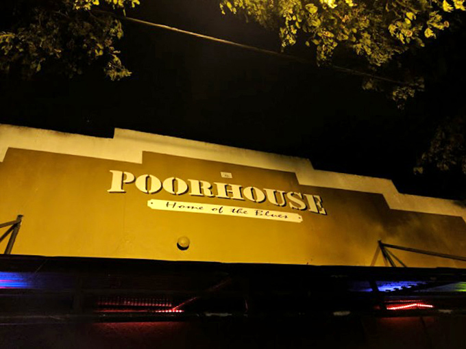 Graffiti, band posters, and alternative vibes. The Poorhouse interior is like a time capsule of cool that never went out of style.