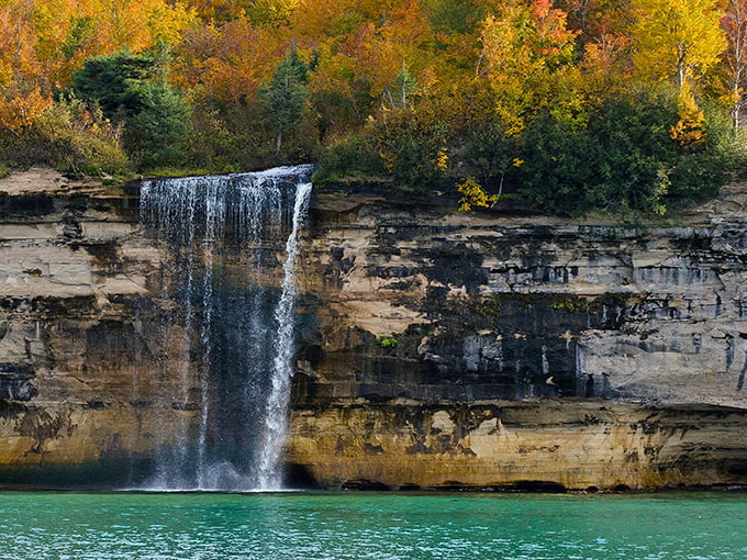 Nature's own IMAX: Spray Falls cascades down colorful sandstone cliffs, creating a spectacle that puts Hollywood special effects to shame.