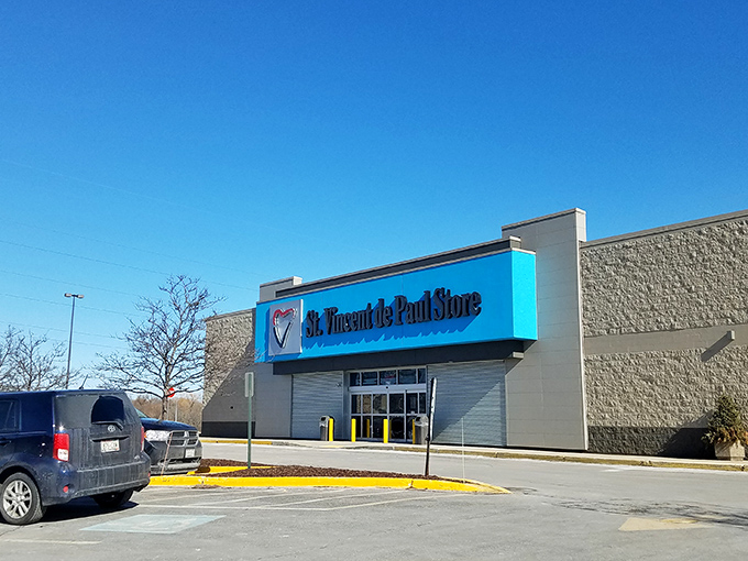 Welcome to the thrift store wonderland! This blue-trimmed facade promises a treasure trove of bargains and surprises waiting just beyond those sliding doors.