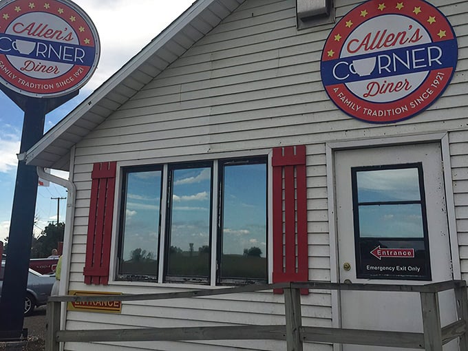 A slice of Americana, served with a side of nostalgia! Allen's Corner Diner stands proud, its red-trimmed facade a beacon for hungry souls and breakfast enthusiasts alike.