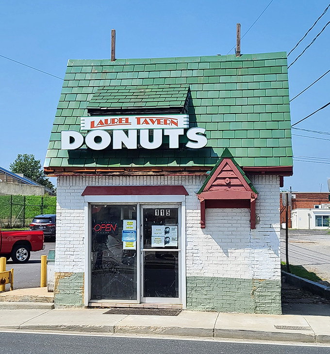 A donut lover's beacon of hope! This charming white brick building with its bold "DONUTS" sign is like a lighthouse guiding sugar-seekers to sweet salvation.
