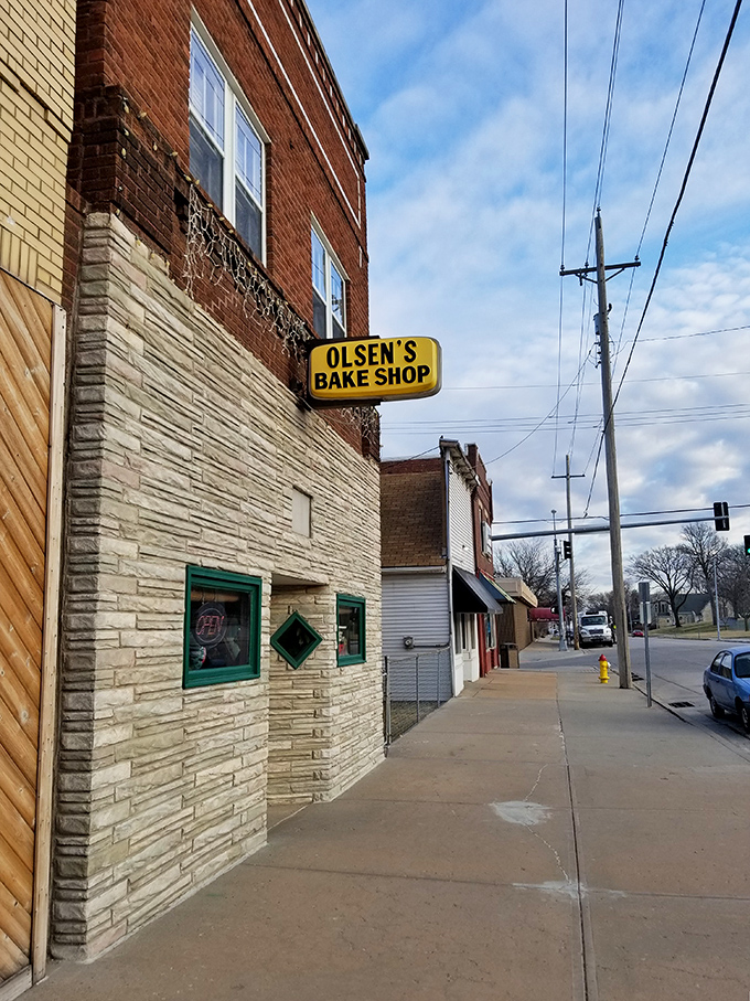 A beacon of sweetness! Olsen's Bake Shop stands proud, its vintage sign promising sugary delights within those whitewashed walls.
