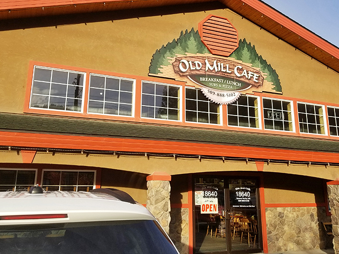 Welcome to the Old Mill Cafe, where rustic charm meets culinary magic. This cozy log cabin-style eatery promises a feast for both your eyes and taste buds!