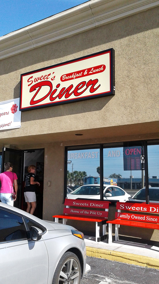 Welcome to flavor town! Sweet's Diner's retro sign promises a trip down memory lane, with a side of crispy bacon.