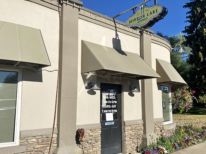 A floral welcome that's prettier than your grandma's Sunday best! Mirror Lake Diner's exterior blooms with charm, promising a feast for both eyes and stomach.