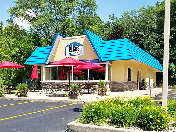 Welcome to breakfast paradise! Luke's Cafe's cheery exterior is like a ray of sunshine, promising delicious adventures within. Who needs a pot of gold when you've got a blue-roofed diner?