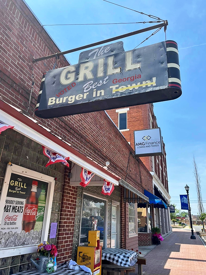 Welcome to burger paradise! The Grill's vintage sign promises the "Best Burger in Town," and boy, does it deliver on that mouthwatering pledge.