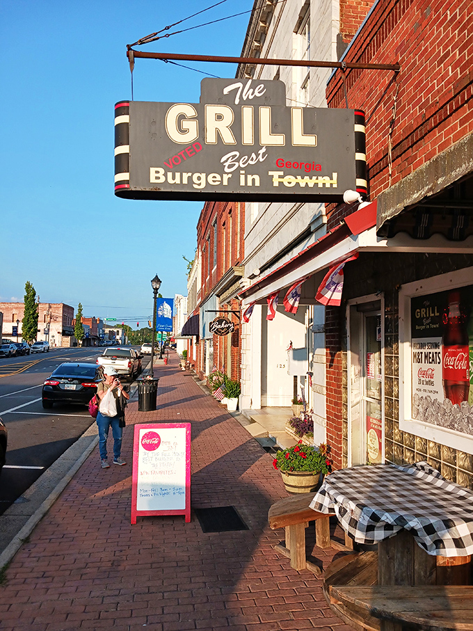 Welcome to burger paradise! The Grill's vintage sign promises the "Best Burger in Town," and boy, does it deliver on that mouthwatering pledge.