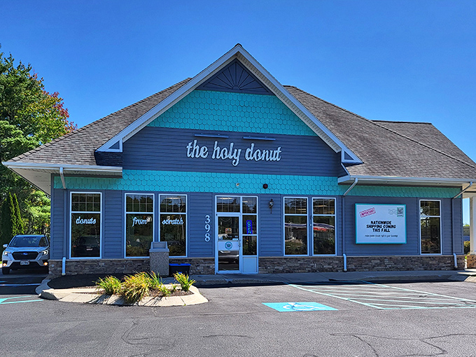 Holy moly, donut lovers! This teal-and-gray haven is where carb dreams come true. The Holy Donut's charming exterior promises a heavenly experience inside.