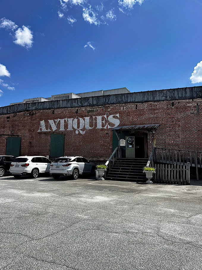 "Antiques" in giant letters? It's like the Bat-Signal for vintage lovers! This brick behemoth promises treasures galore.