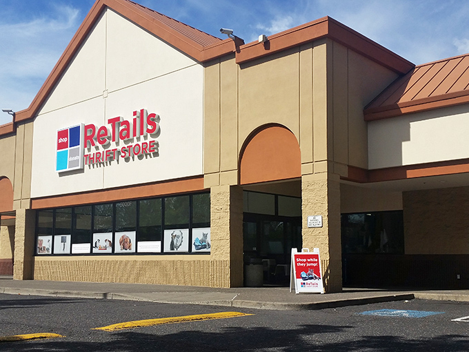 ReTails Thrift Store's welcoming storefront features adorable pet photos, setting the tone for a shopping adventure that helps our four-legged friends.