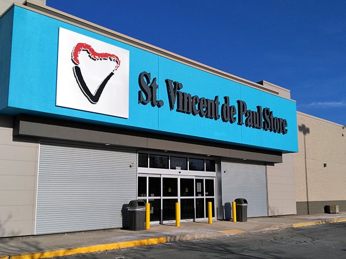 Welcome to the thrift store wonderland! This blue-trimmed facade promises a treasure trove of bargains and surprises waiting just beyond those sliding doors.