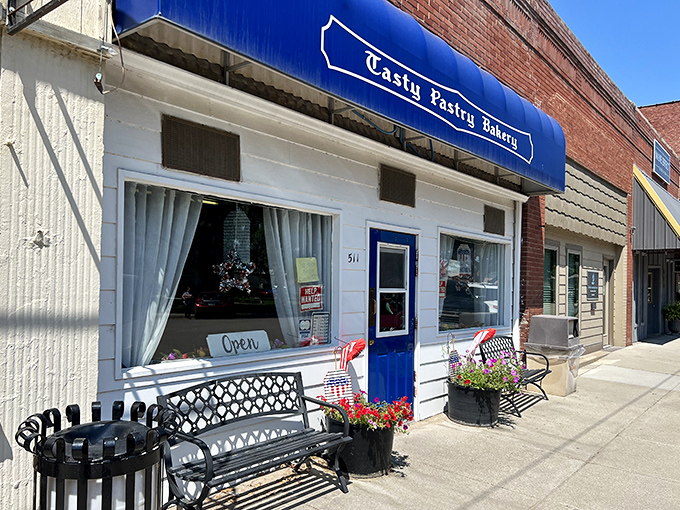 A slice of small-town heaven! Tasty Pastry Bakery's charming storefront beckons with the promise of sugary delights and a warm welcome.