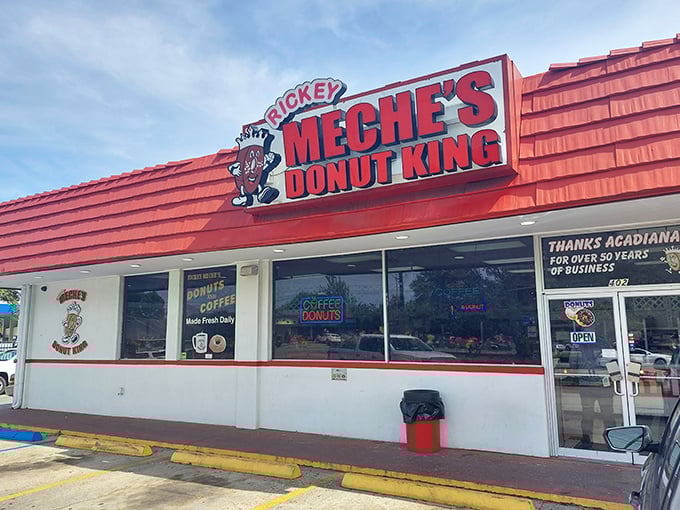 Welcome to donut paradise! Rickey Meche's Donut King stands proud, its red roof a beacon of sugary salvation for Lafayette's sweet-toothed masses.