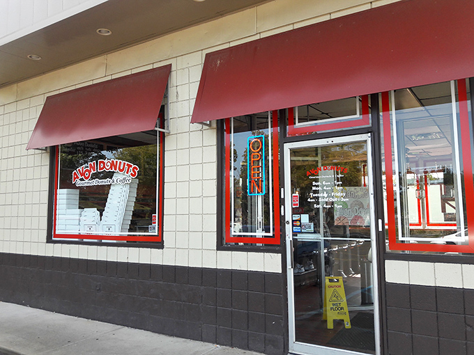 Welcome to donut paradise! Avon Donuts' cheery red awnings beckon like a siren song to sweet-toothed sailors navigating the streets of Pontiac.
