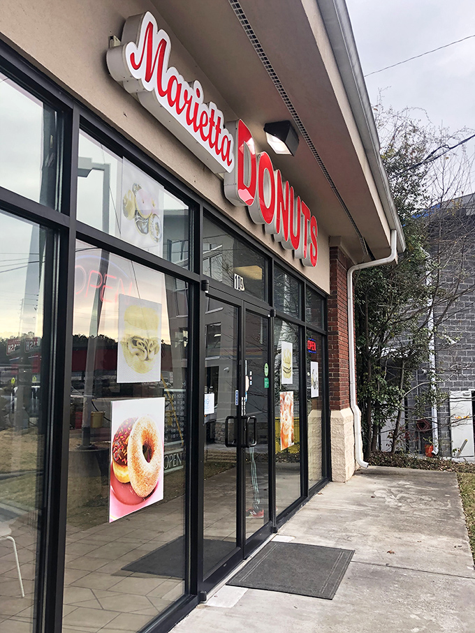 Welcome to donut paradise! Marietta Donuts' storefront promises a sugar-coated adventure that'll make your taste buds do a happy dance.