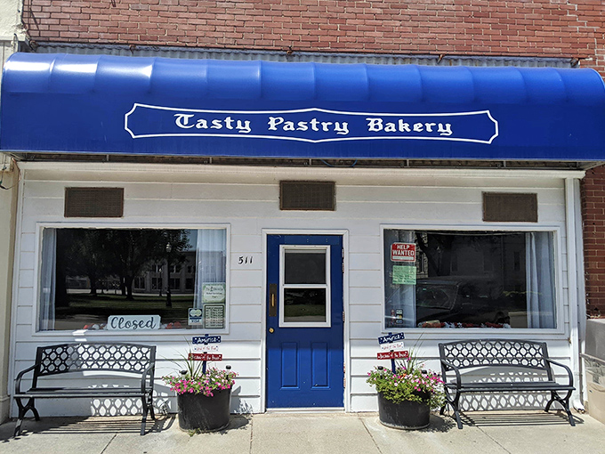 A slice of small-town heaven! Tasty Pastry Bakery's charming storefront beckons with the promise of sugary delights and a warm welcome.