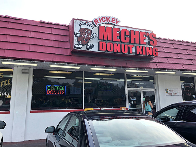 Welcome to donut paradise! Rickey Meche's Donut King stands proud, its red roof a beacon of sugary salvation for Lafayette's sweet-toothed masses.