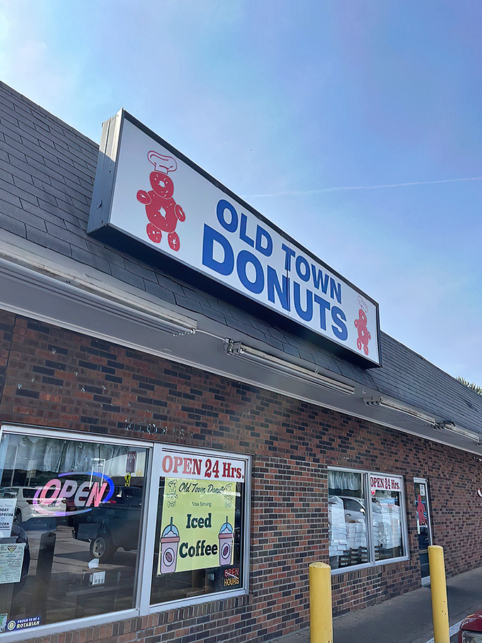 Welcome to donut paradise! Old Town Donuts beckons with its cheery red sign, promising sweet delights and a slice of small-town charm.