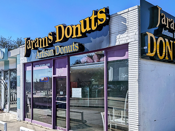A purple-trimmed beacon of sugary salvation! Jarams Donuts stands out like a confectionery oasis, promising sweet relief from the ordinary.