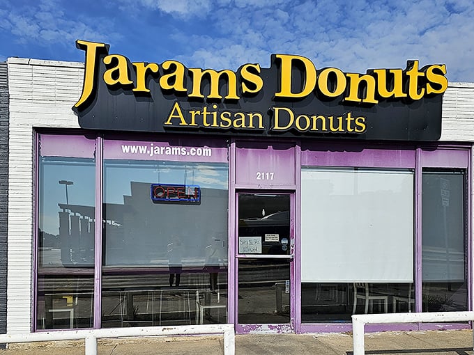 A purple-trimmed beacon of sugary salvation! Jarams Donuts stands out like a confectionery oasis, promising sweet relief from the ordinary.