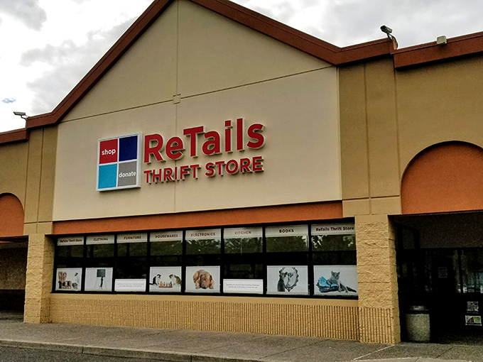ReTails Thrift Store's welcoming storefront features adorable pet photos, setting the tone for a shopping adventure that helps our four-legged friends.