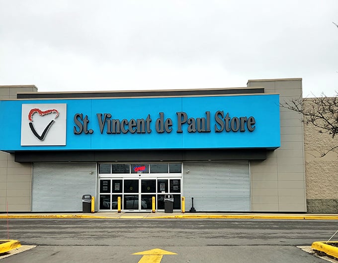 Welcome to the thrift store wonderland! This blue-trimmed facade promises a treasure trove of bargains and surprises waiting just beyond those sliding doors.