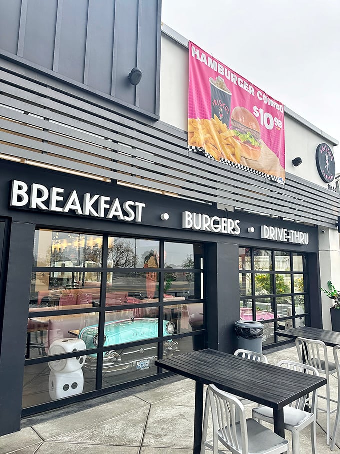 Step back in time! Frisco's neon sign beckons like a beacon from the past, promising burgers, shakes, and a hefty dose of nostalgia.