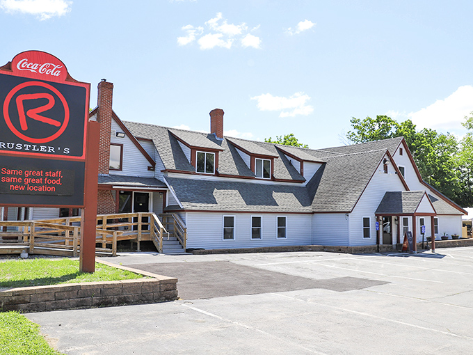 A slice of Americana with a side of sizzle! Rustler's Steak House stands proud, its white clapboard and red trim beckoning hungry travelers like a lighthouse for the famished.