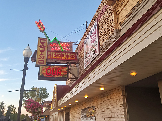 Neon dreams and sizzling steams! This vintage facade is like a beacon for hungry souls in the Montana night.